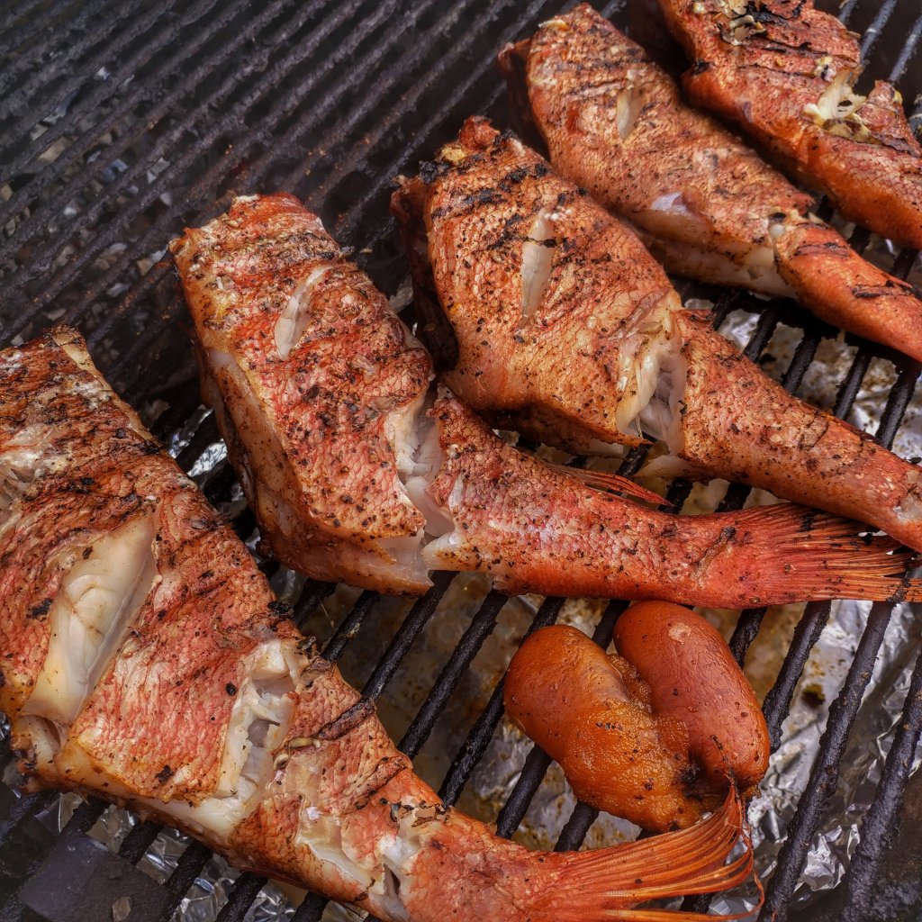 Tail of the redfish being prepped for the @webergrills performer. A www ...